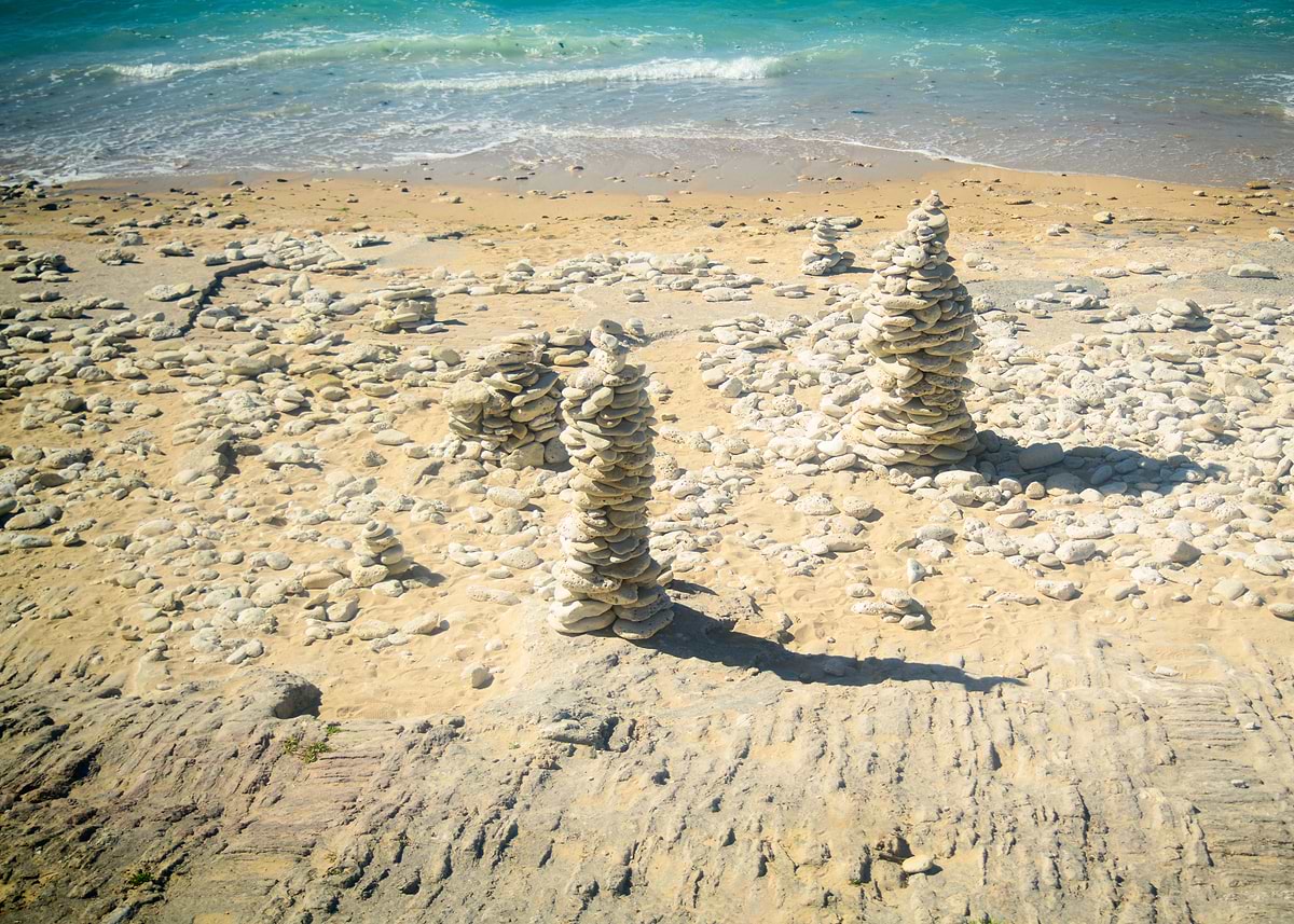 'Pile of stones on beach' Poster, picture, metal print, paint by Youri ...