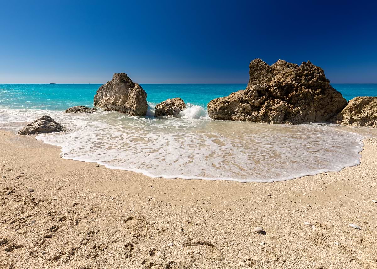 'Sandy beach with rocks on the Greek island of Lafkada' Poster, picture ...