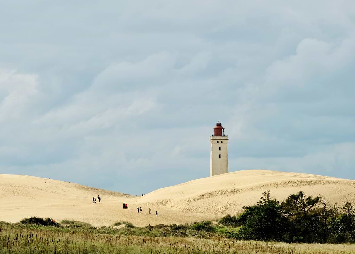 'Lighthouse on Sand Dunes with People' Poster, picture, metal print ...