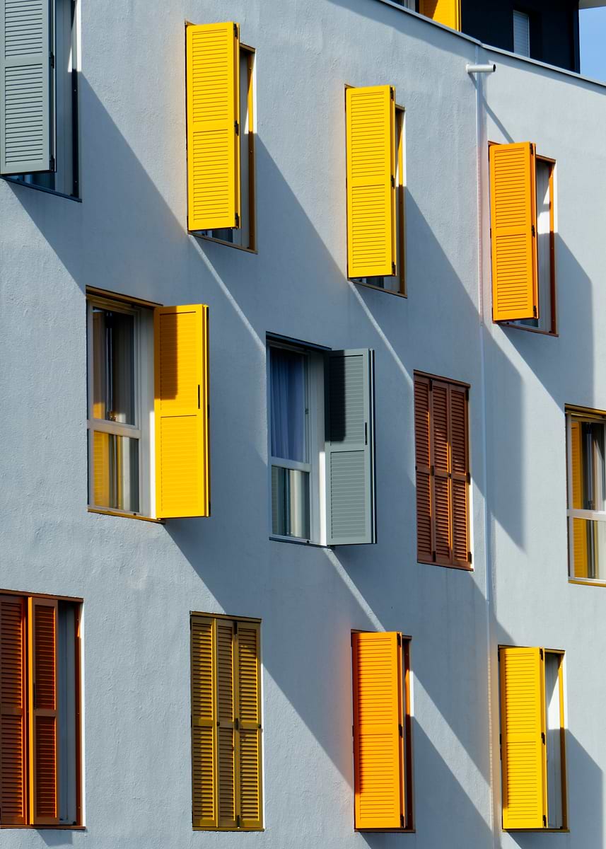 'Building Facade with Colorful Shutters' Poster, picture, metal print ...