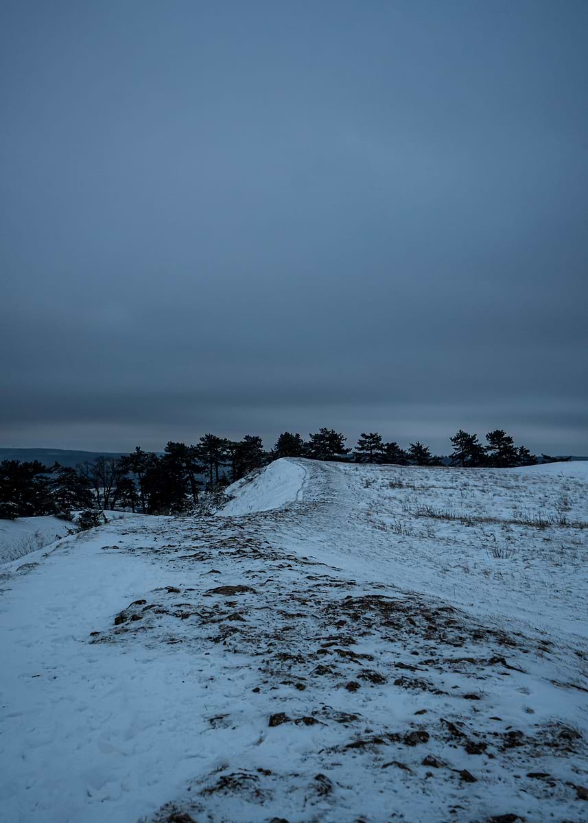 'Snowy Hill Landscape Under Cloudy Sky' Poster, picture, metal print ...